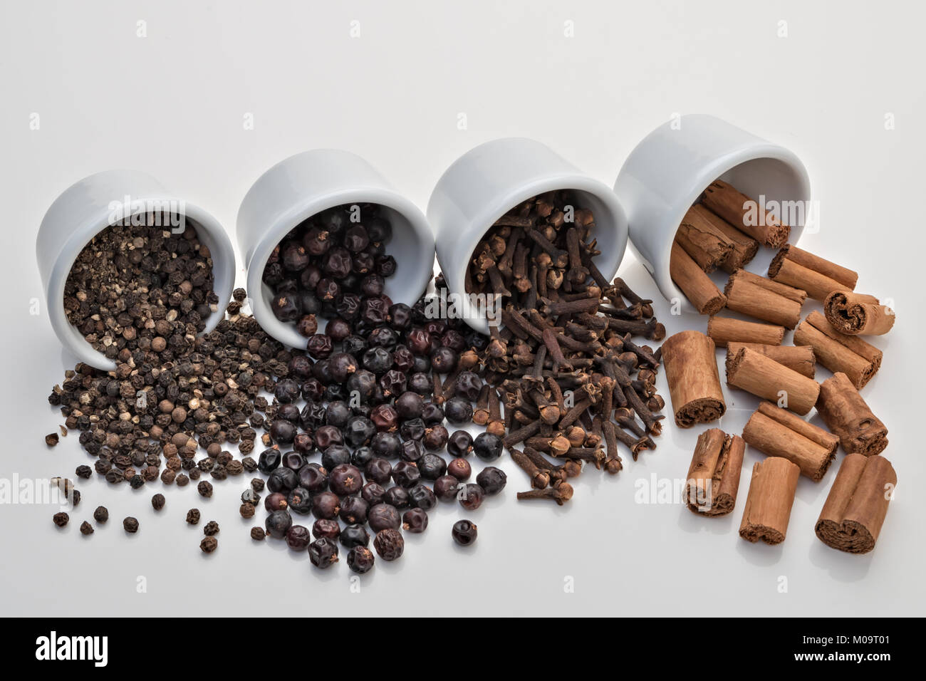 spices black pepper juniper cloves cinnamon in inverted slats Stock ...