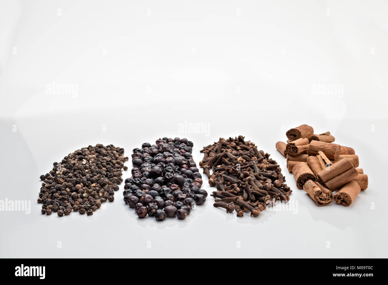 spices black pepper juniper cloves cinnamon in slats facing upside down ...