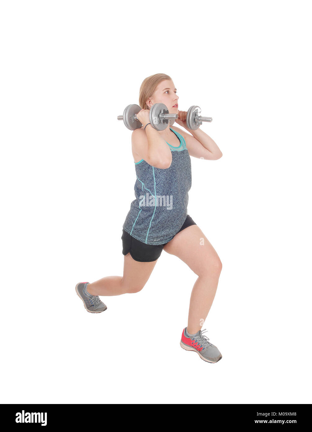 A young fit and slim woman lifting her two dumbbell's, isolated for ...