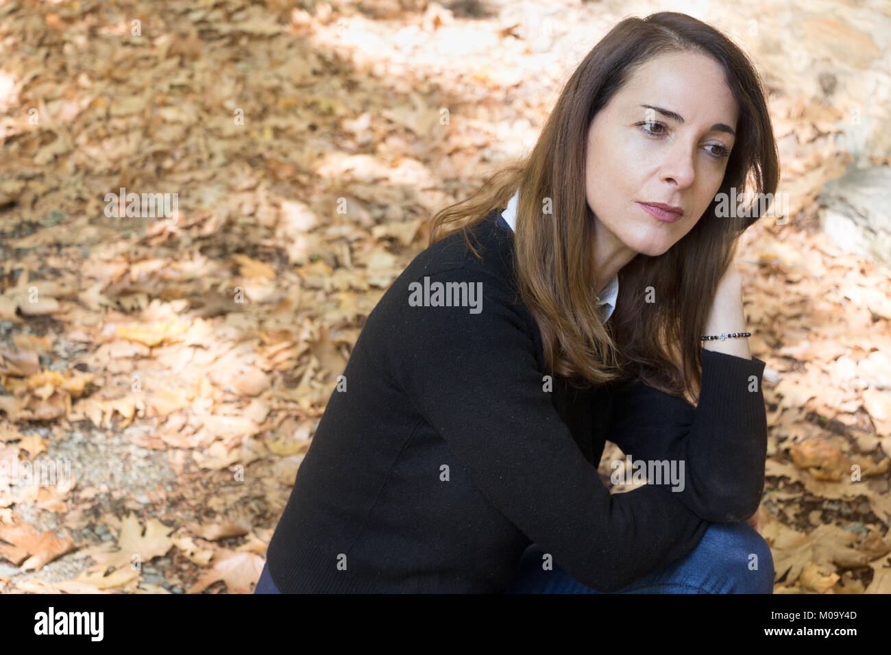 Portrait of a mature woman, 46 years, thinking, looking away, dreaming ...