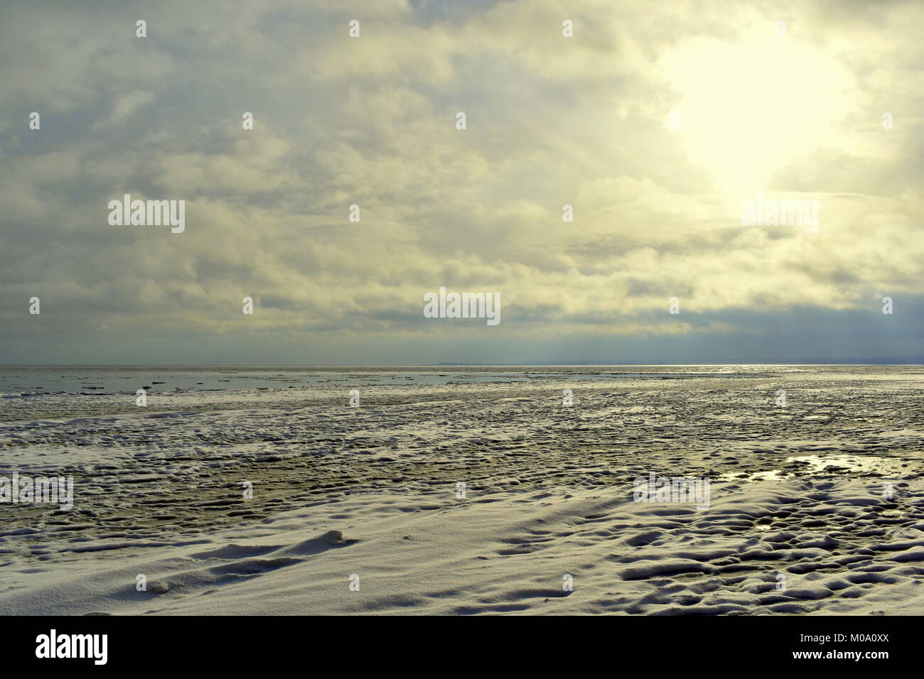 The dramatic cloudy sky over the Baltic sea. Winter coastal landscape ...