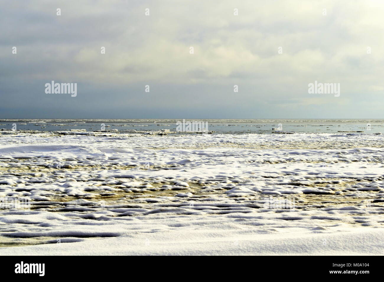 The dramatic cloudy sky over the Baltic sea. Winter coastal landscape ...