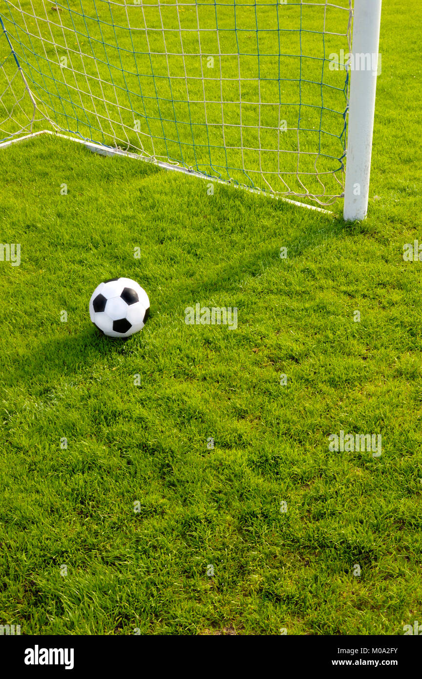 Soccer ball into the net, goal and success concept Stock Photo - Alamy