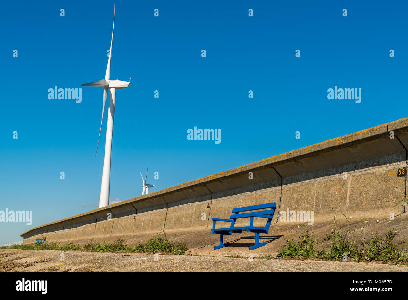 A bench and wind turbines in Queenborough, Isle of Sheppey, Kent ...