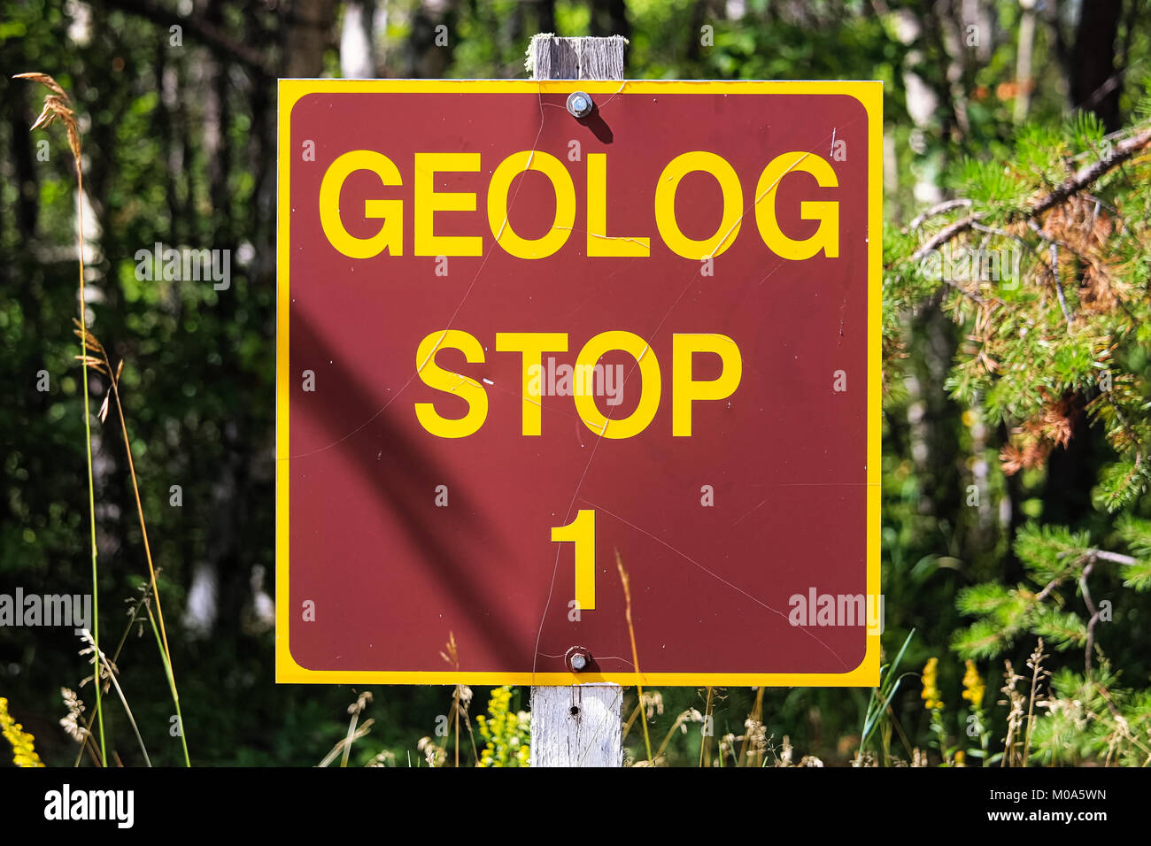 A Geolog Stop sign at a park Stock Photo - Alamy