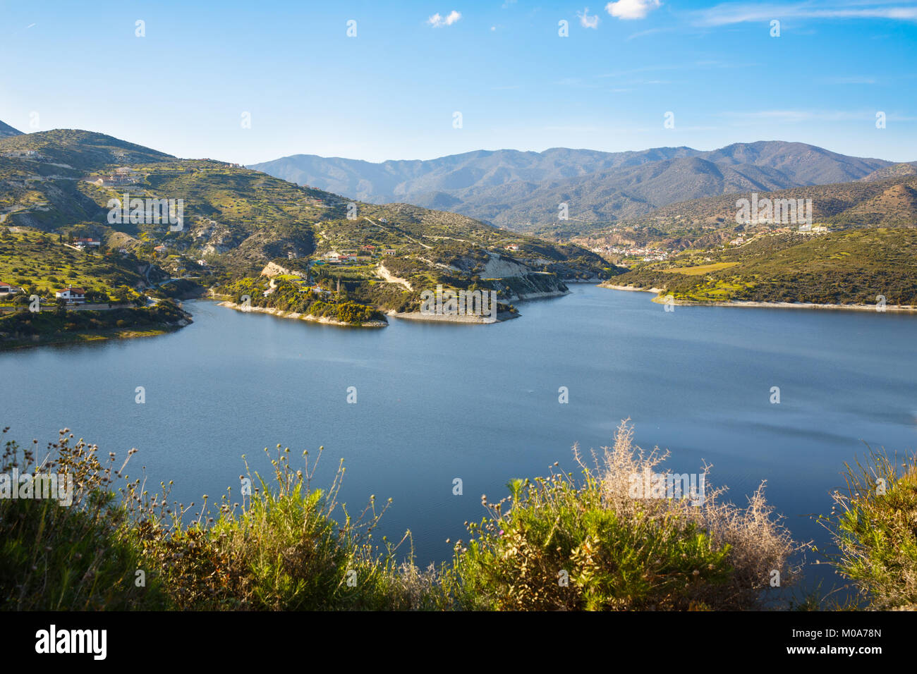 Cyprus landscape with mountains, lake and village Stock Photo - Alamy