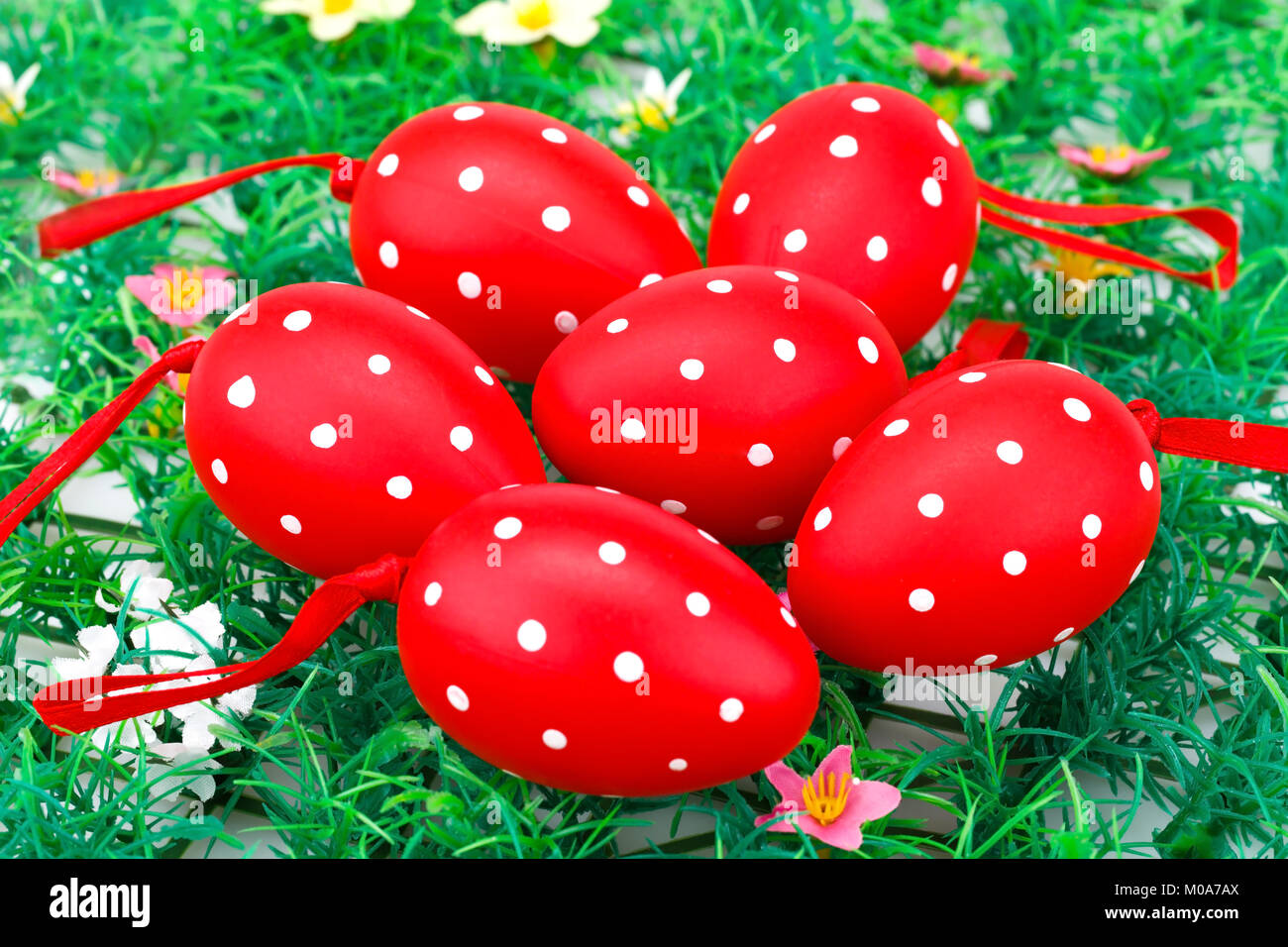Easter red spotted eggs on artificial grass background Stock Photo - Alamy