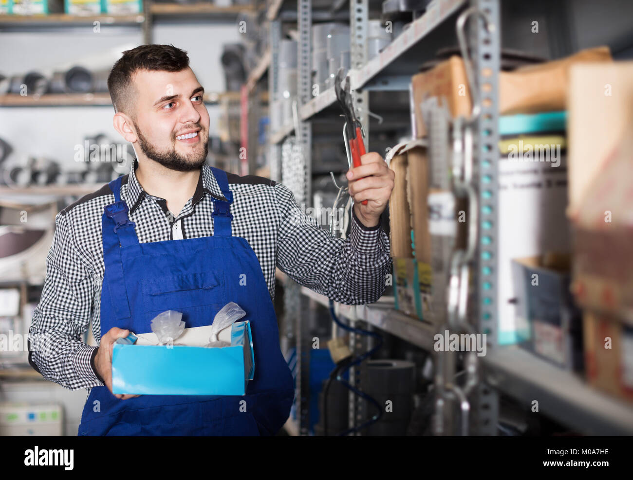 Man worker showing his constructing tools at workplace Stock Photo - Alamy