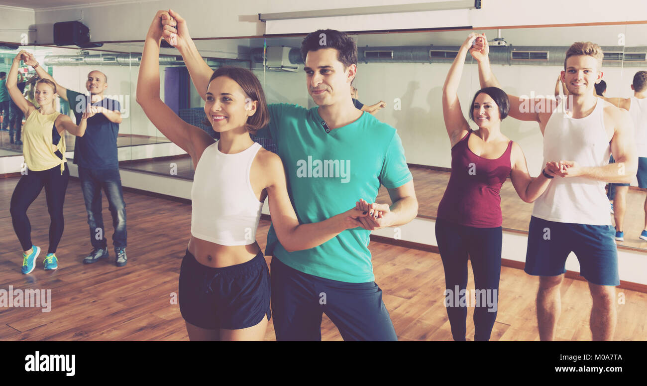 Positive dancing couples learning salsa at dance class Stock Photo - Alamy