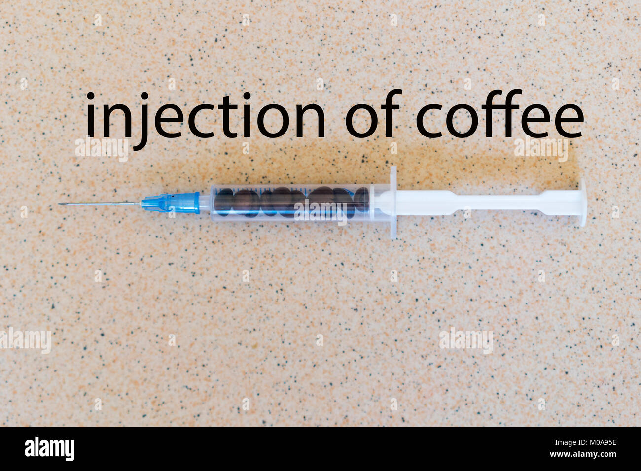 Coffee dependence. Syringe and grains of coffee. The inscription ...