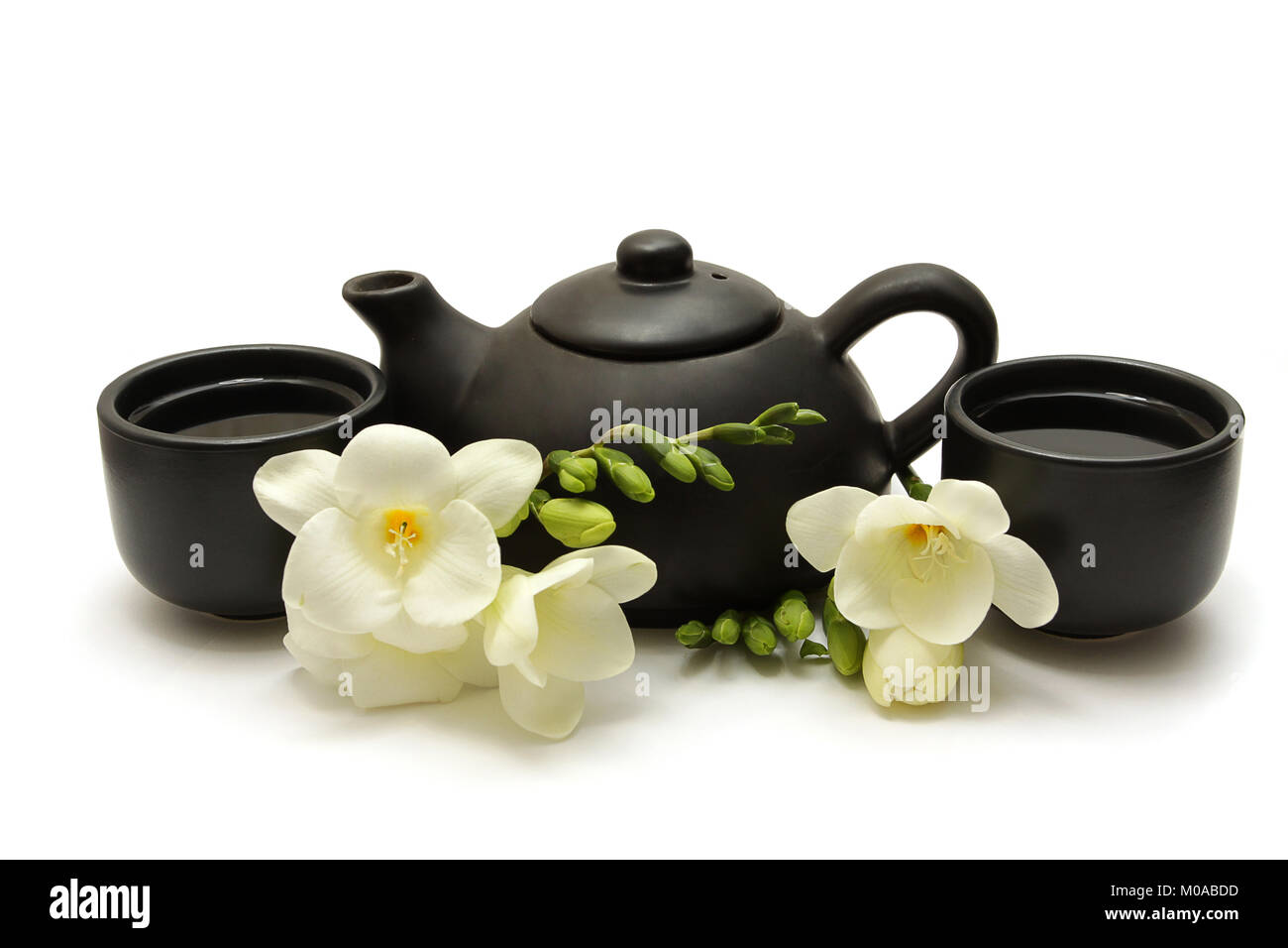 Chinese Tea Set with Teapot, cups and white flowers Stock Photo - Alamy