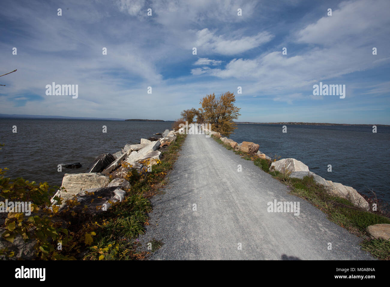 Female bike rider on a beautiful path with Fall colors Stock Photo - Alamy