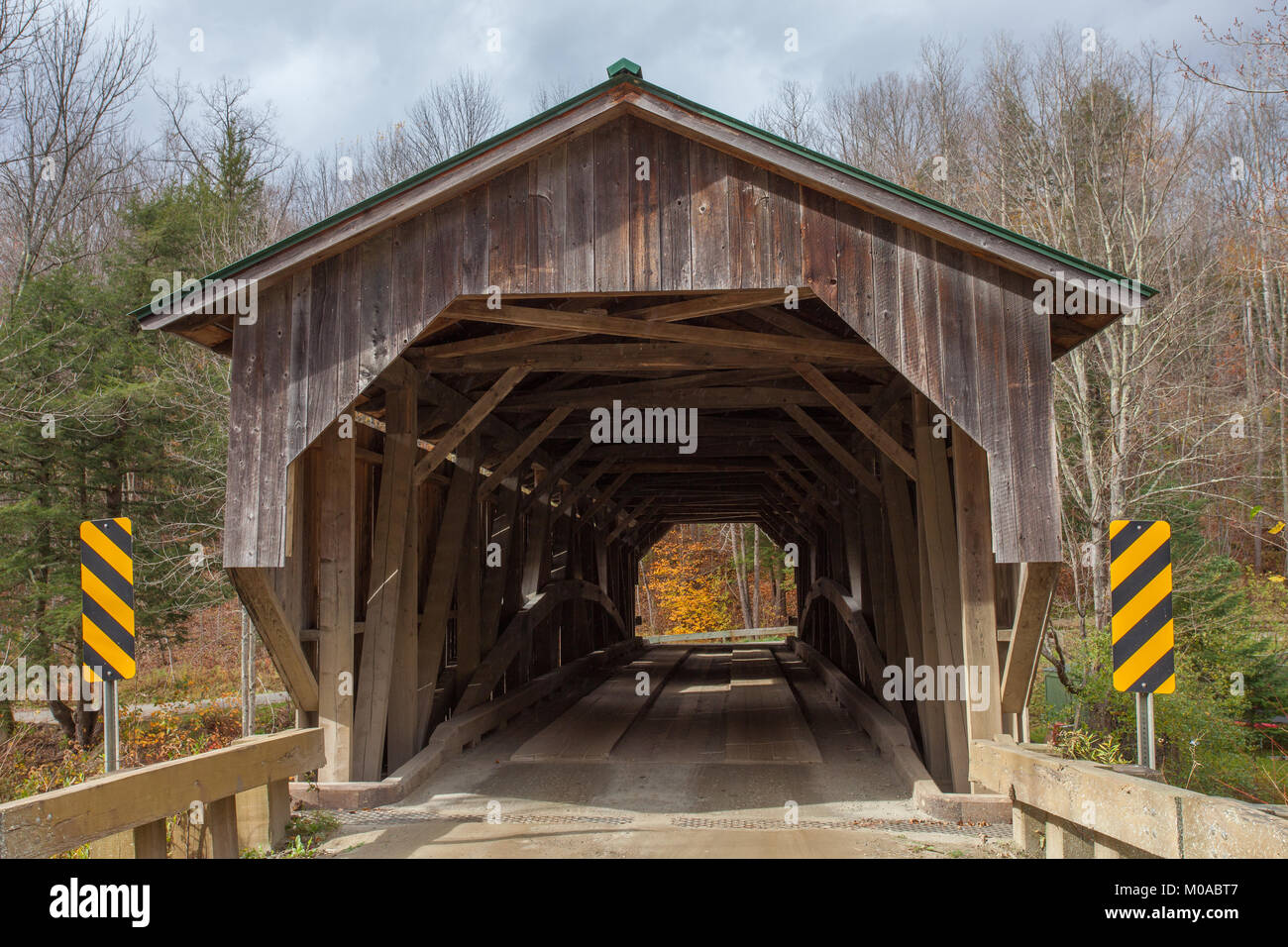 Wooden covered bridge in Vermont with Fall colors Stock Photo - Alamy