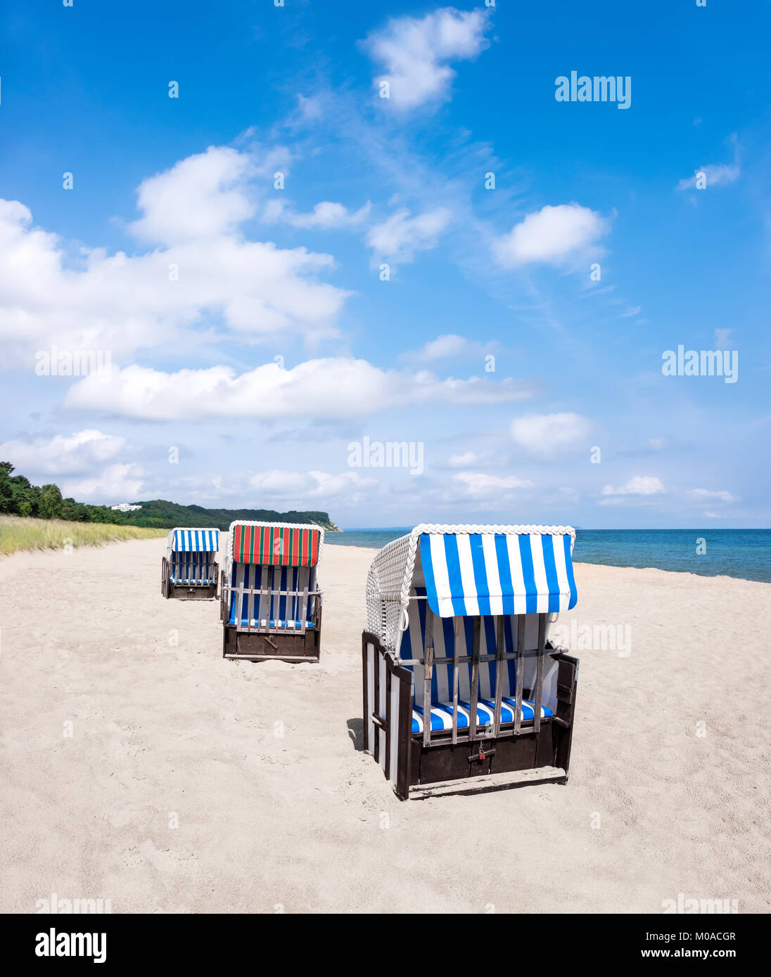 Sandy beach and traditional wooden beach chairs on island Rugen ...