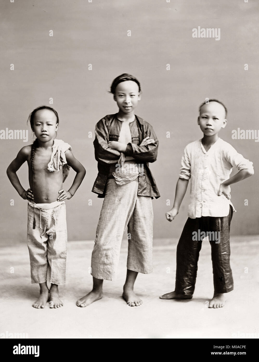 Portrait of three Chinese boys in a studio setting, China, c.1900 Stock ...