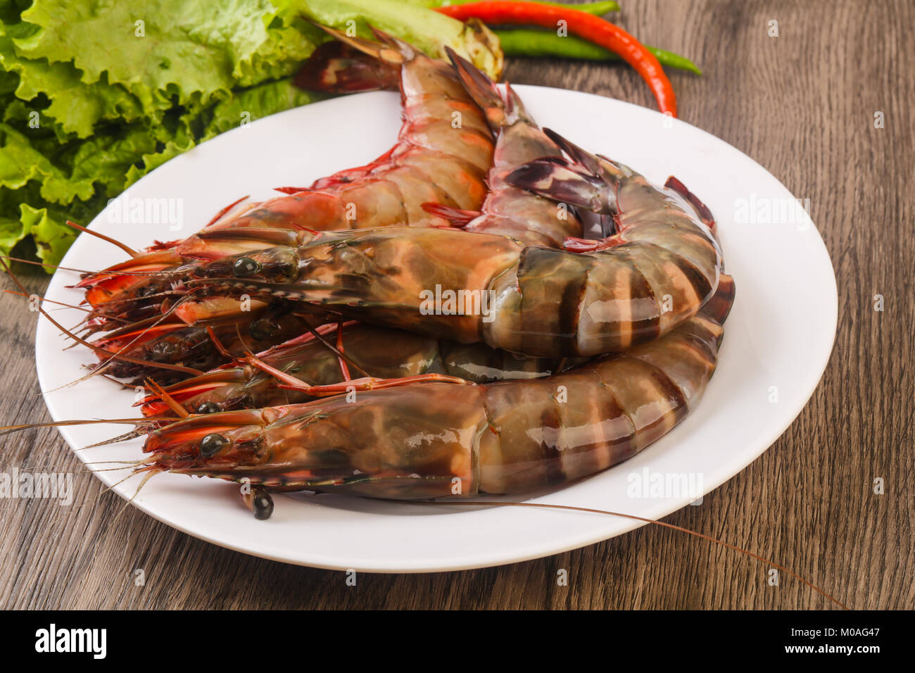 Raw big tiger prawn - ready for cooking Stock Photo - Alamy