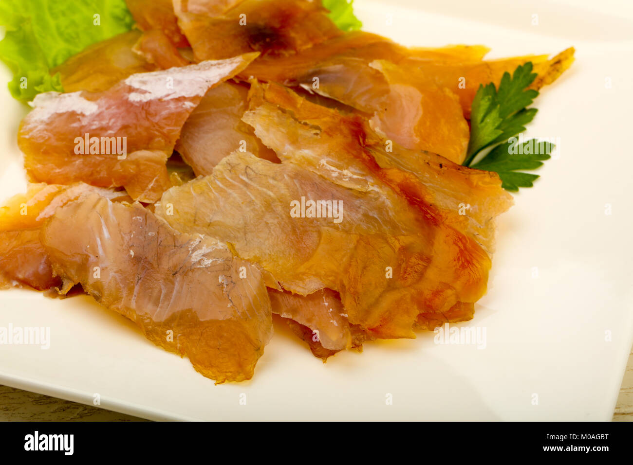 Smoked catfish fillet carpaccio Stock Photo - Alamy