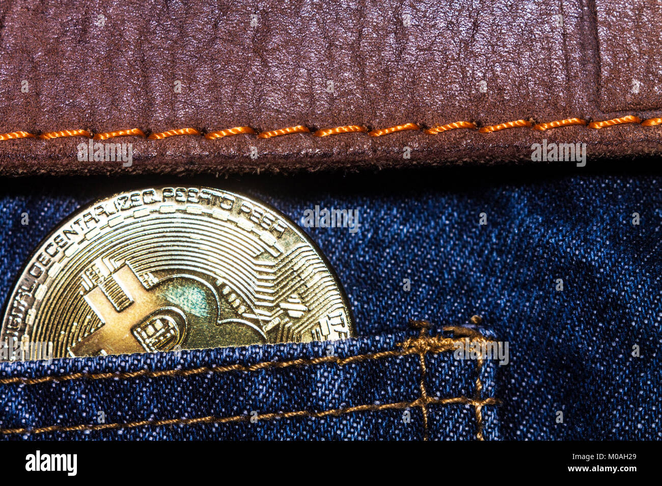 Bitcoin blue jeans and brown leather belt Stock Photo - Alamy