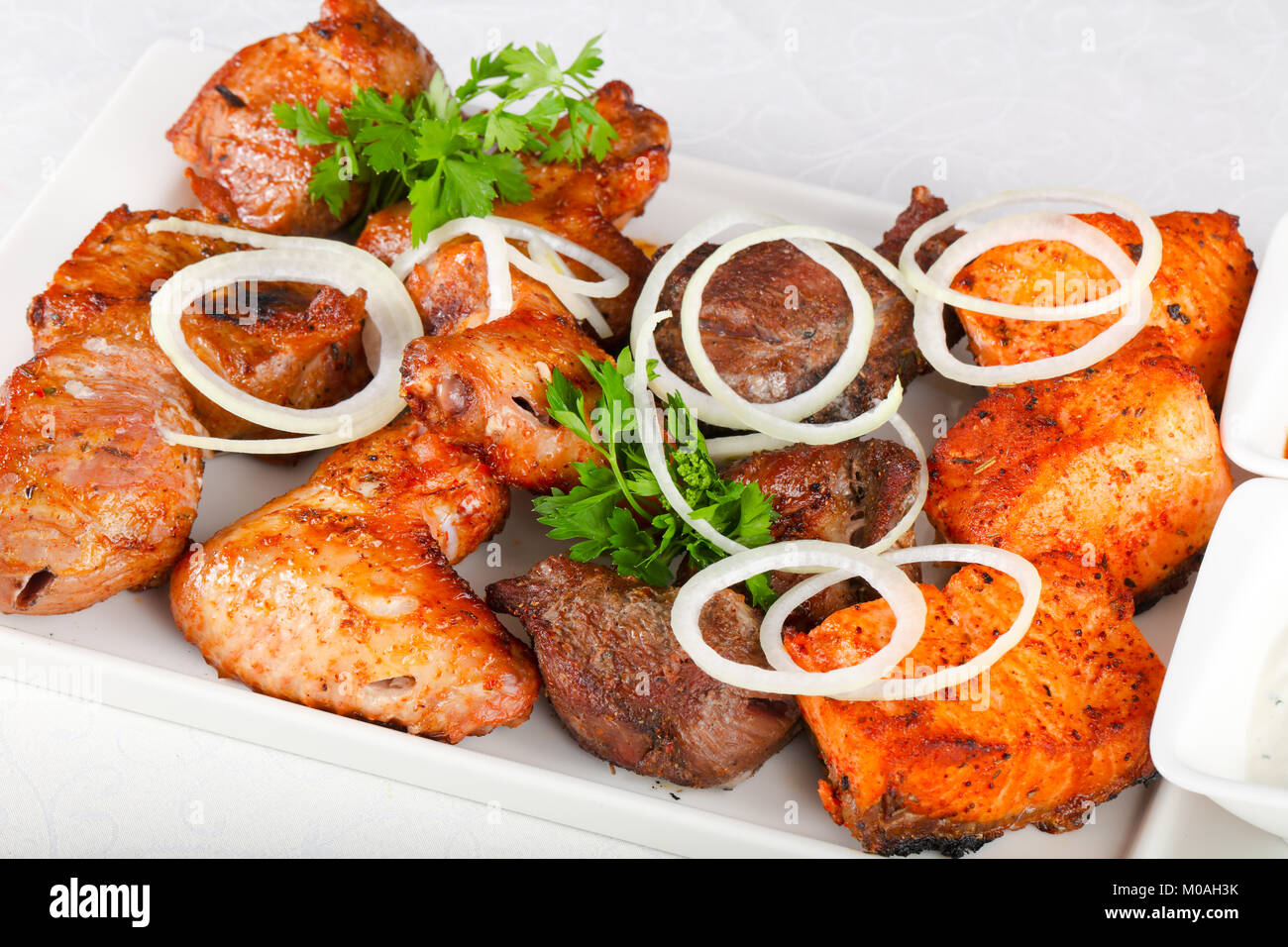 BBQ mix - chicken, pork, beef and salmon Stock Photo - Alamy