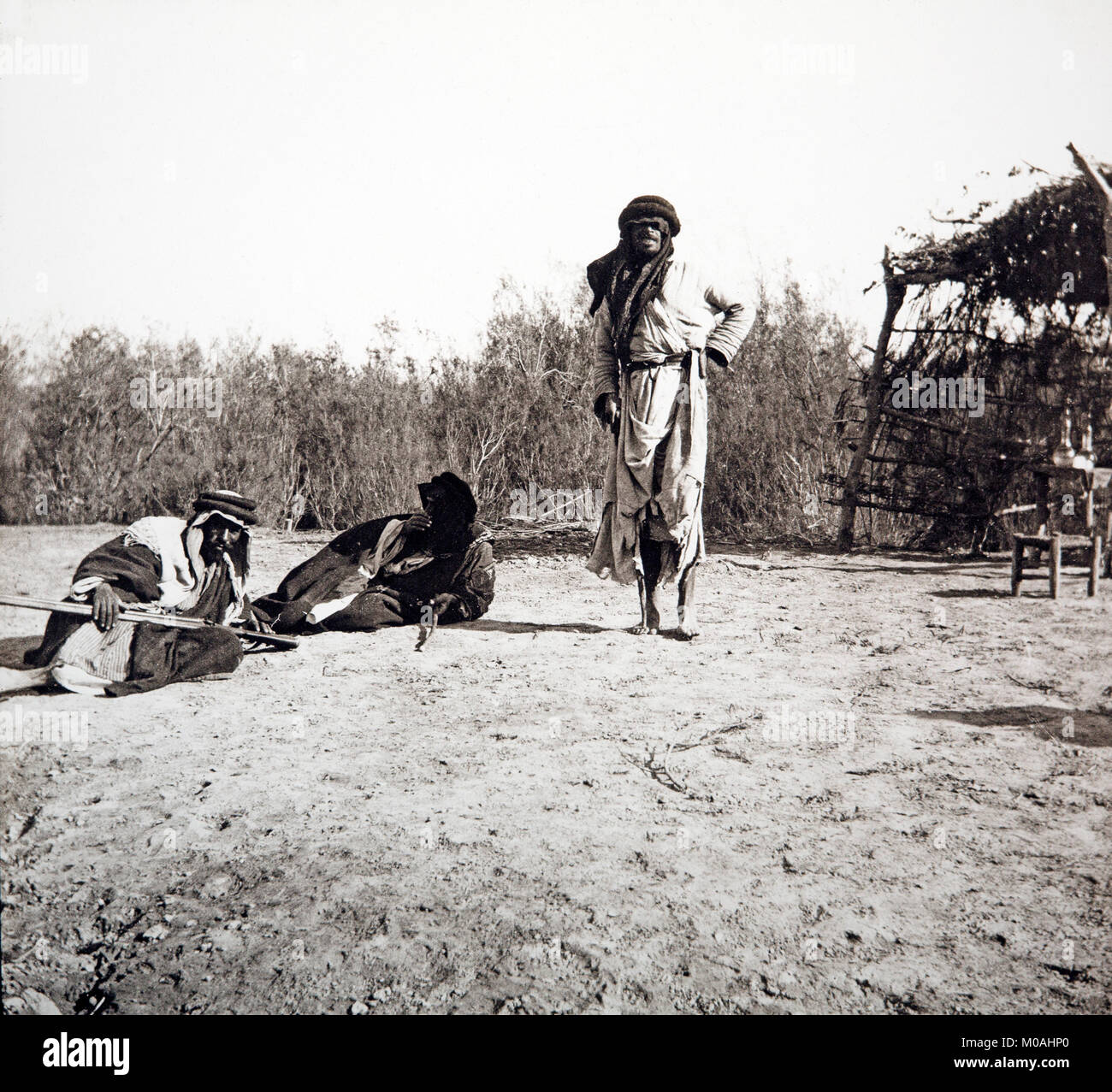 A late 19th or early 20th century black and white photograph of three ...