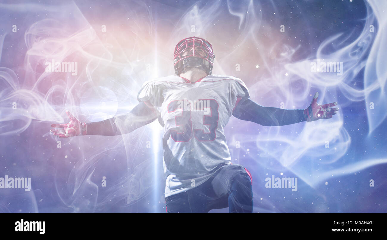 american football player celebrating after scoring a touchdown on the ...