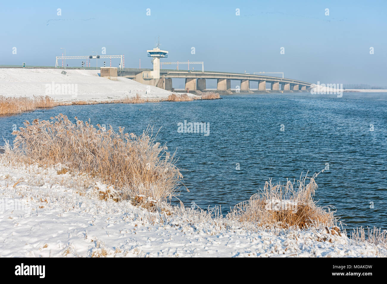 Dutch winter landscape with snow and big concrete bridge Stock Photo ...