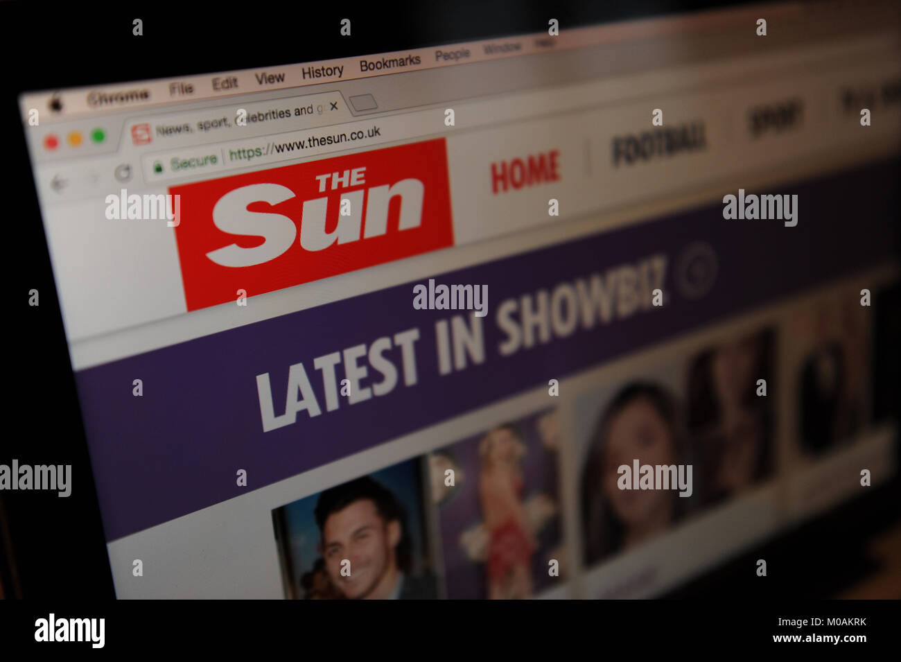 A woman looks at The Sun website Stock Photo - Alamy