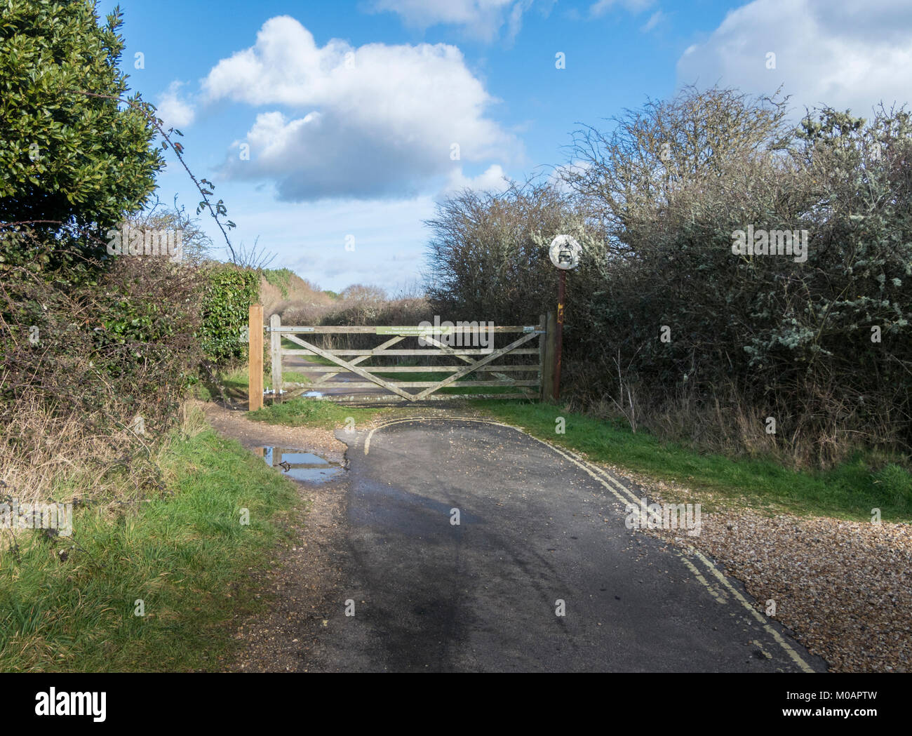 The road coming to an end at a gate in the English countryside Stock ...