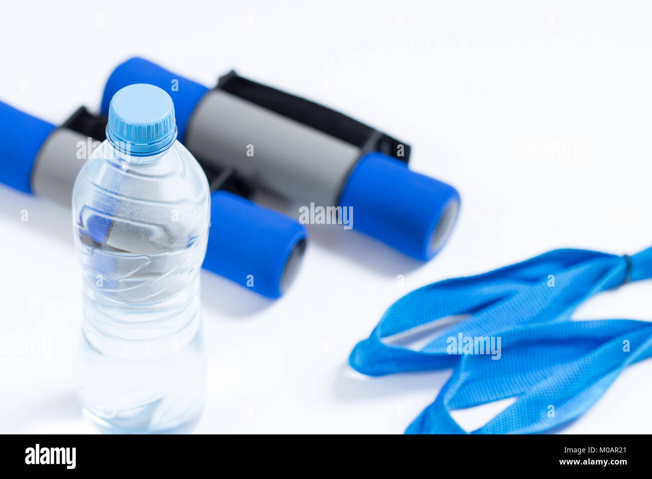 water bottle and exercise equipment isolated on white background Stock ...