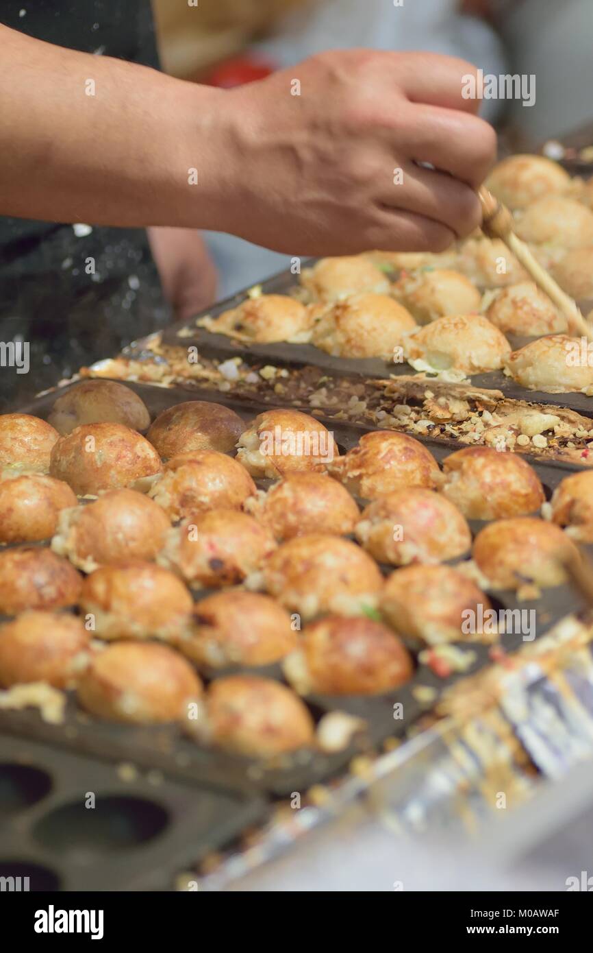 Tokyo street food of Octopus meat balls called Takoyaki Stock Photo - Alamy