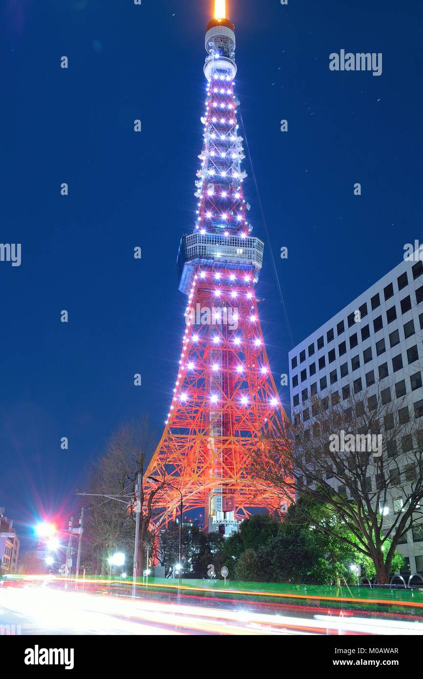 Moving traffic light trails at Tokyo tower. The iconic Tokyo Tower is ...
