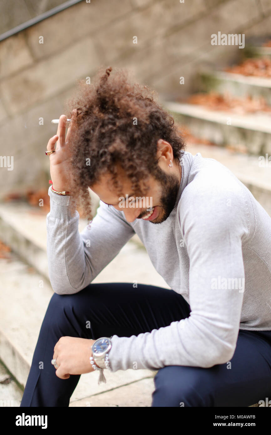 Sad person smoking hi-res stock photography and images - Alamy