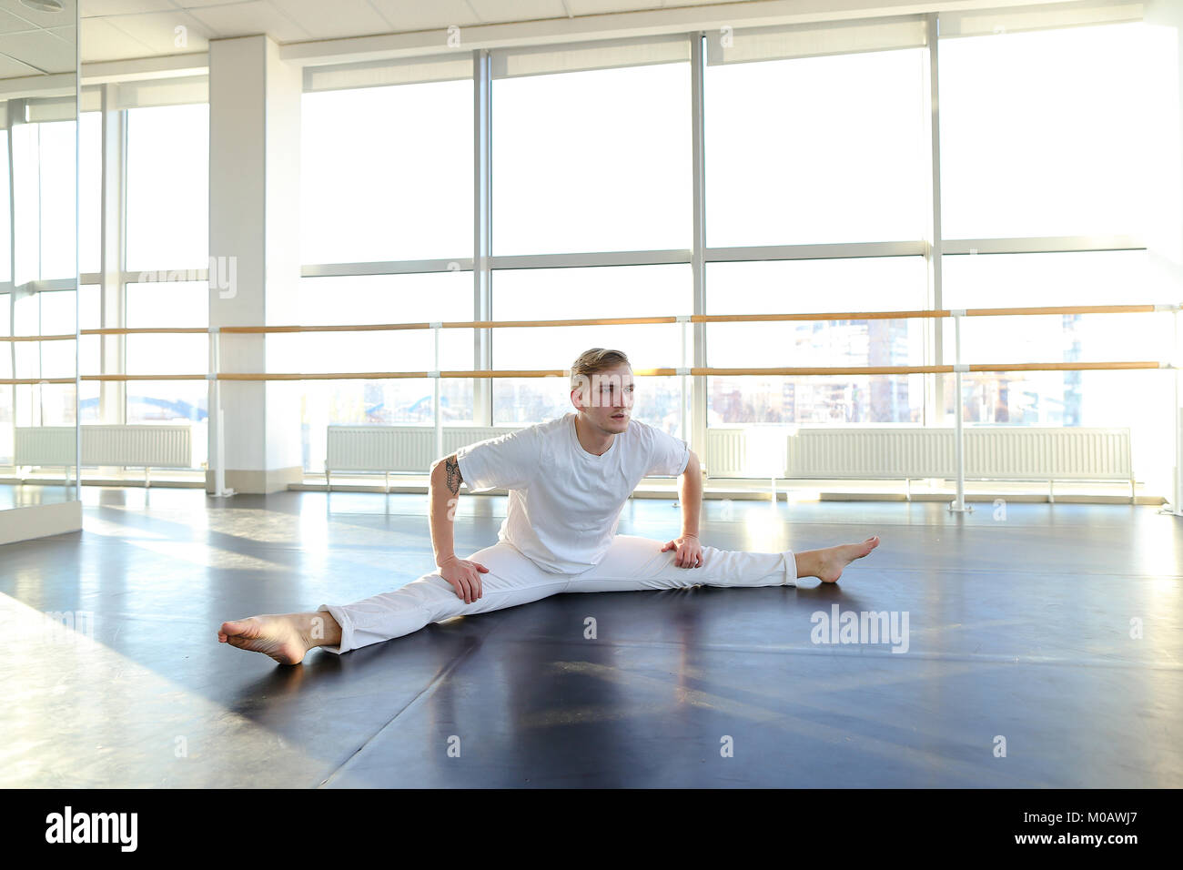 Dance trainer doing backwards close up somersault Stock Photo - Alamy