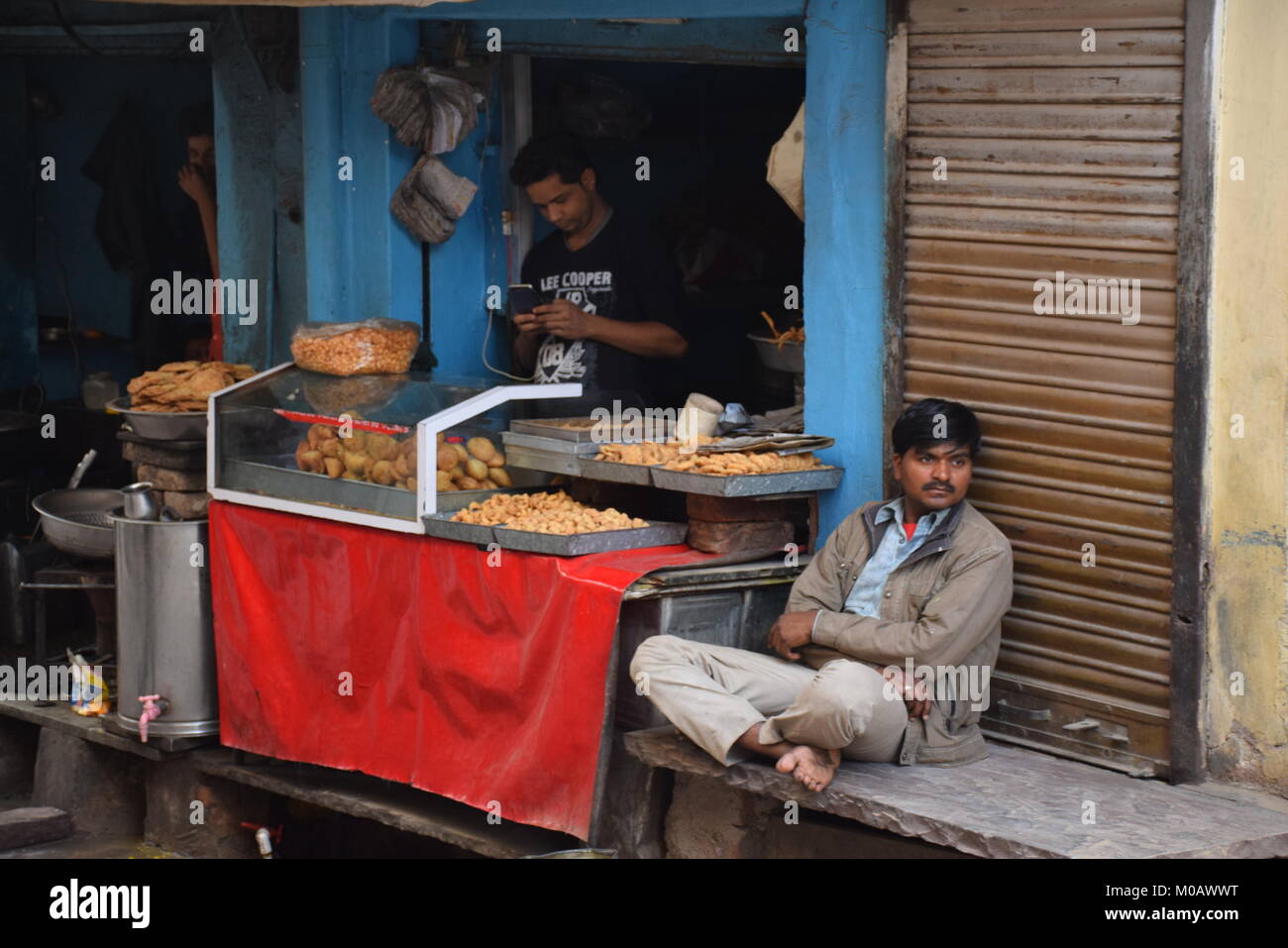 Two indian men selling samosa and other typical indian snacks in their ...