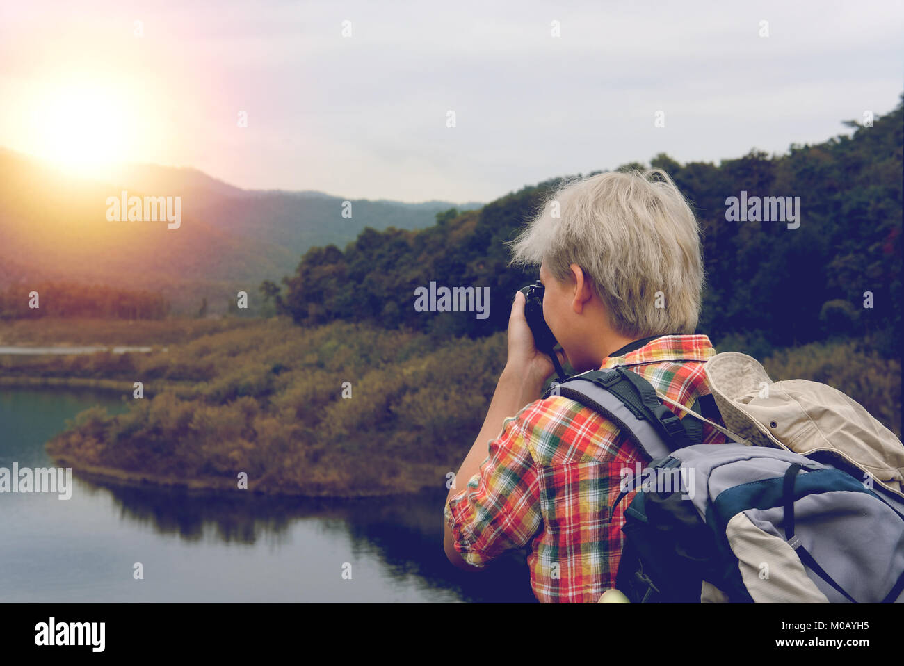 traveler man with backpack travel at mountain & lake. tourist ...