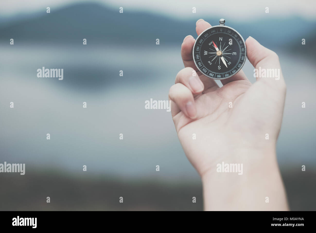 Man explorer searching direction compass hi-res stock photography and ...