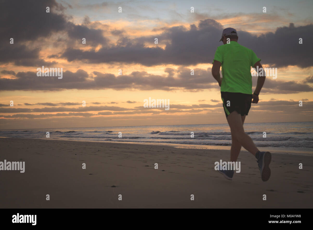 Athlete running on track sunrise hi-res stock photography and images ...