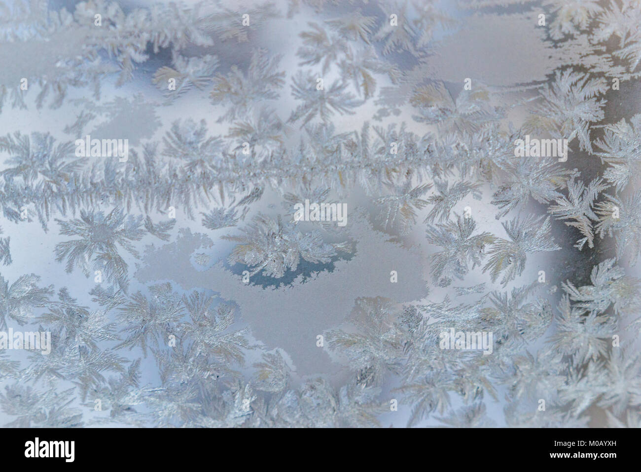 winter window close-up snow patterns on the Windows of frost, snow city ...