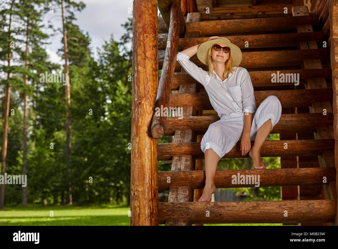 Blonde woman outside house hi-res stock photography and images - Alamy