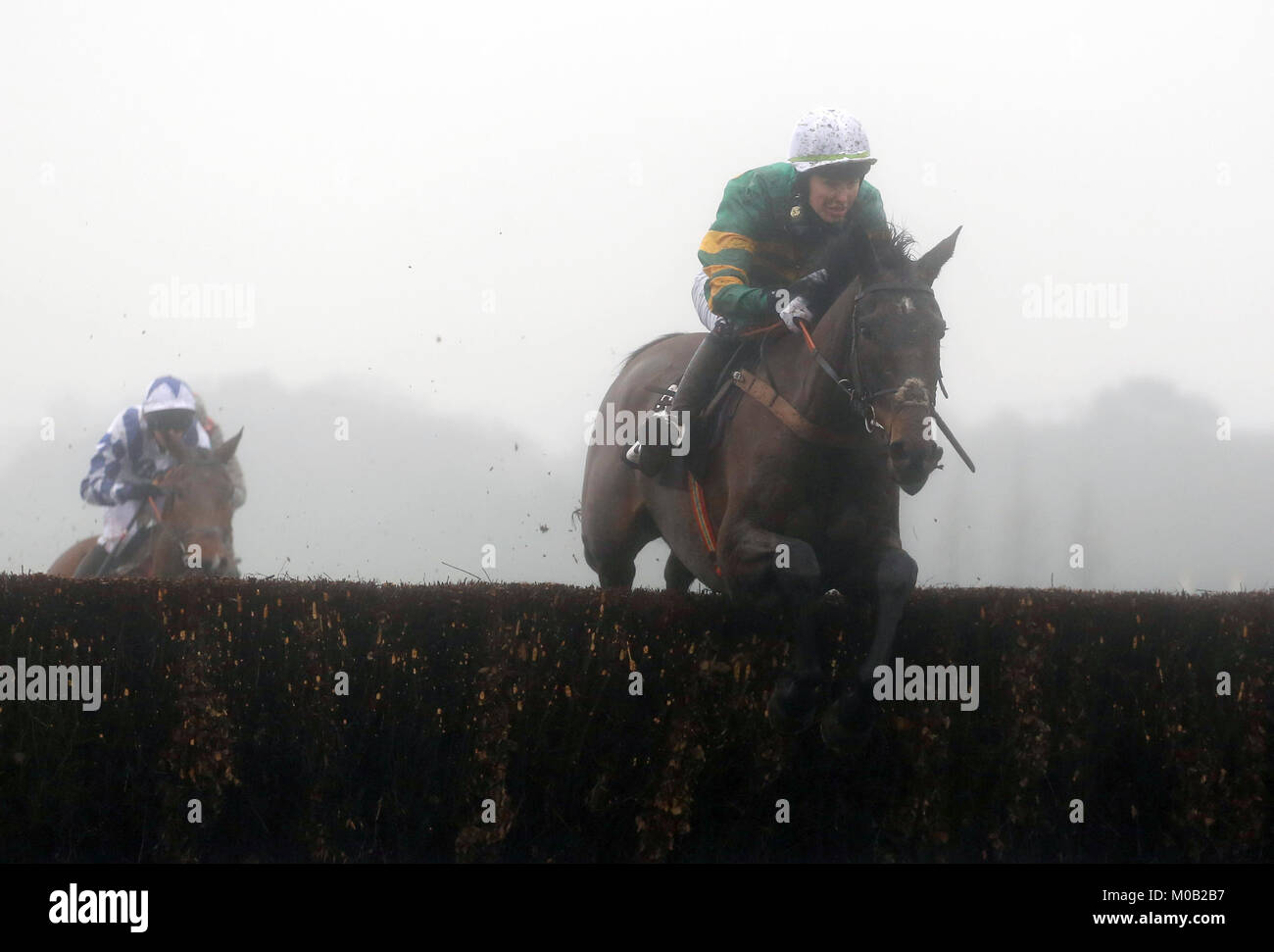 Miss Aine O' Connor and Drumcliff clear the last fence before going on ...