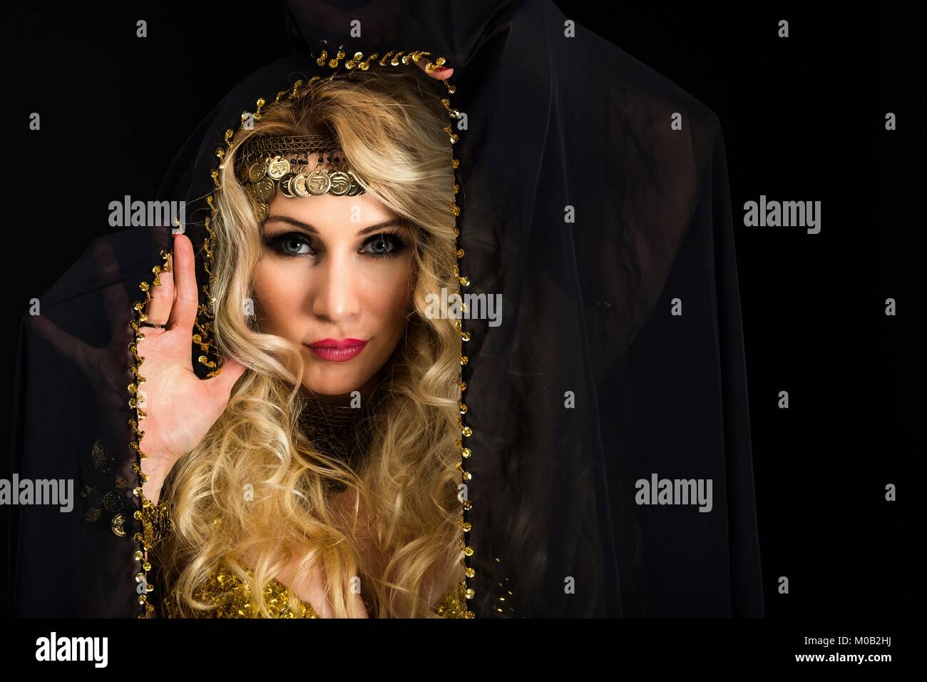 Woman fortune teller portrait at black Stock Photo - Alamy