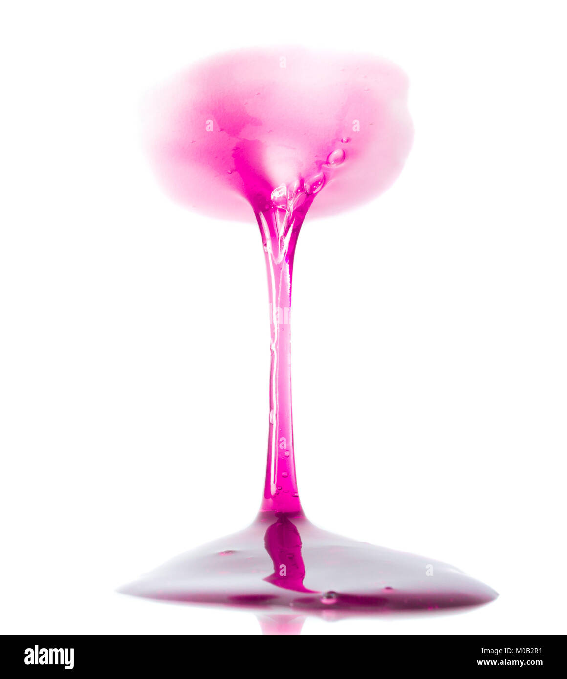 The viscous substance in the form of a colored gel is stretched between ...