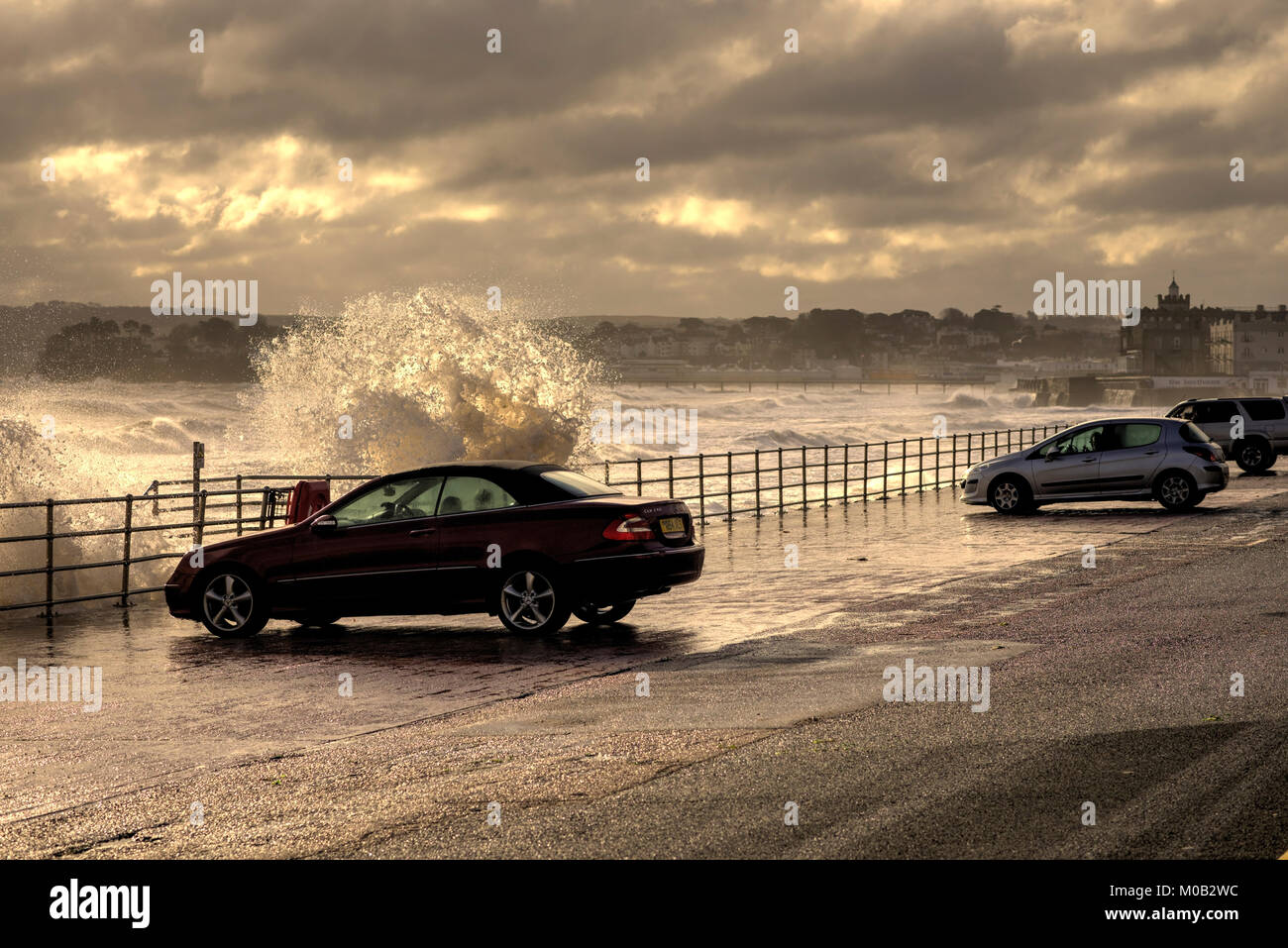 Cars parked on the seafront during a stormy high tide Stock Photo - Alamy
