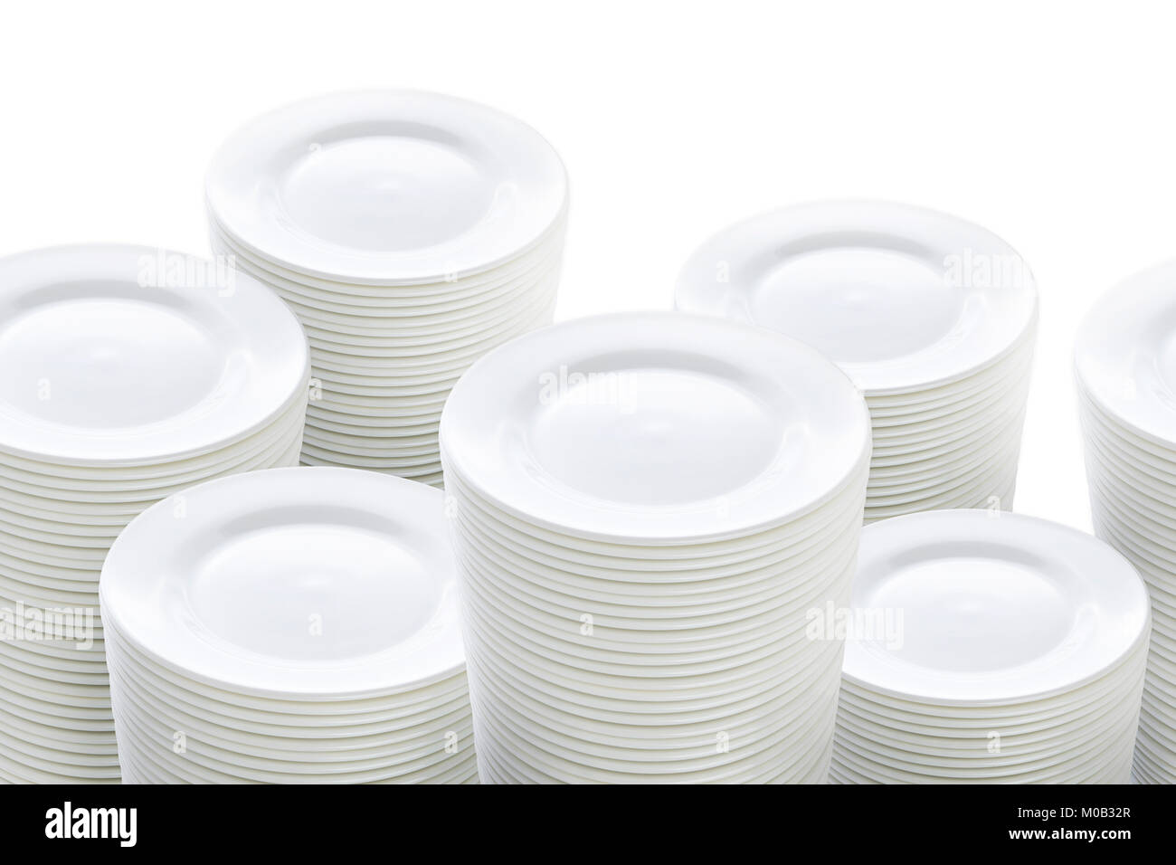 Stack of white plates isolated on white background Stock Photo - Alamy