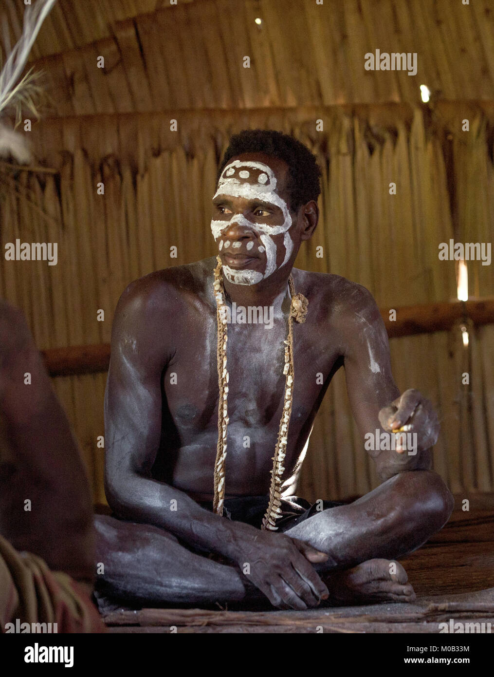 Portrait of a man from the tribe of Asmat people on Asmat Welcoming ...