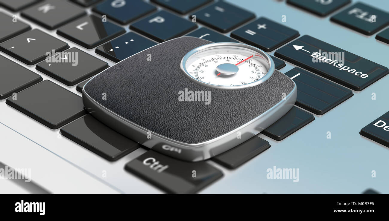 Weight control concept. Bathroom scale on a computer keyboard, view ...