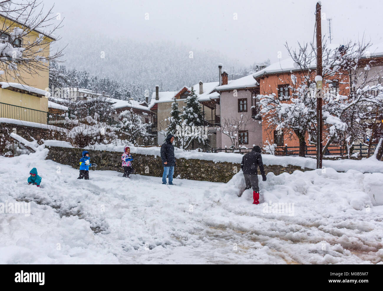 ELATI,TRIKALA/GREECE-JANUARY 13,2018:Family having fun playing with ...