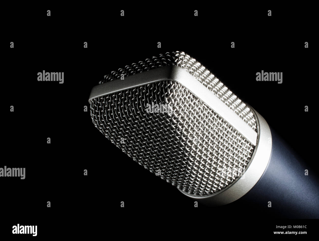 Metal mesh covering a microphone on a black background Stock Photo - Alamy