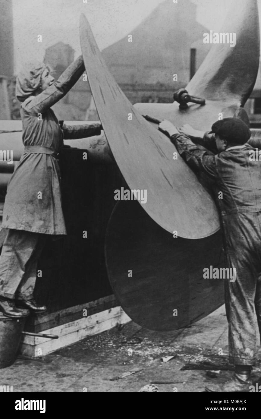 English Workers labor over a ship's Propeller at Shipyard Stock Photo ...