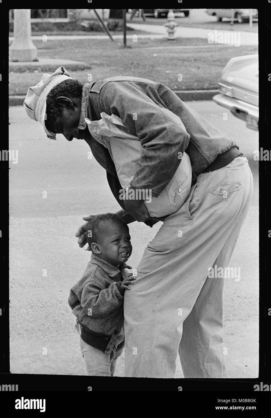 Father comforting his children Black and White Stock Photos & Images ...